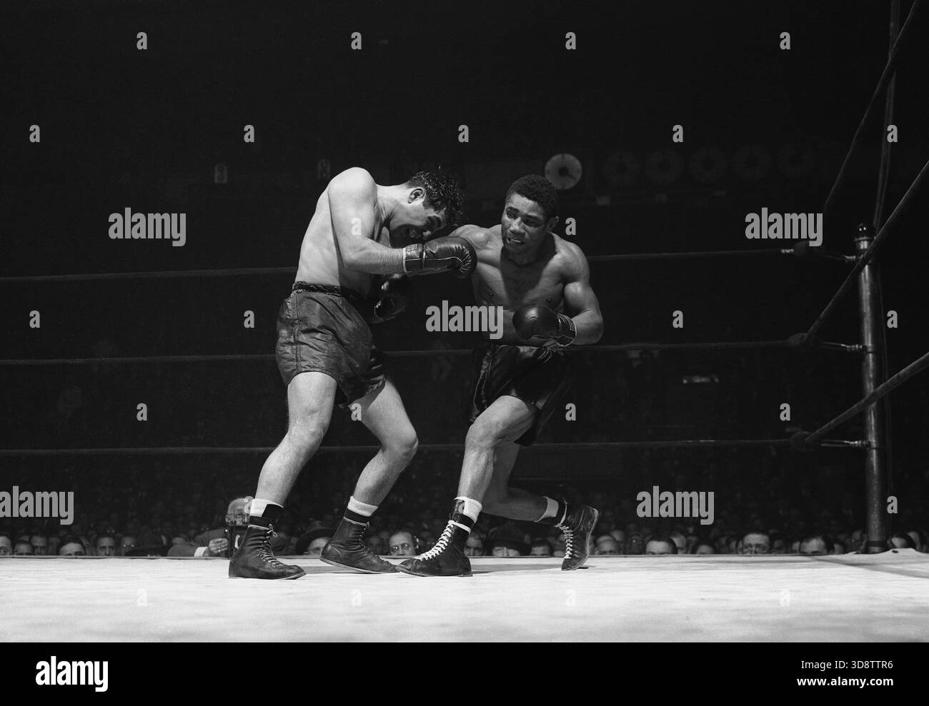 Bouncing Beau Jack, right, of Augusta, Ga., swings a right to Johnny ...