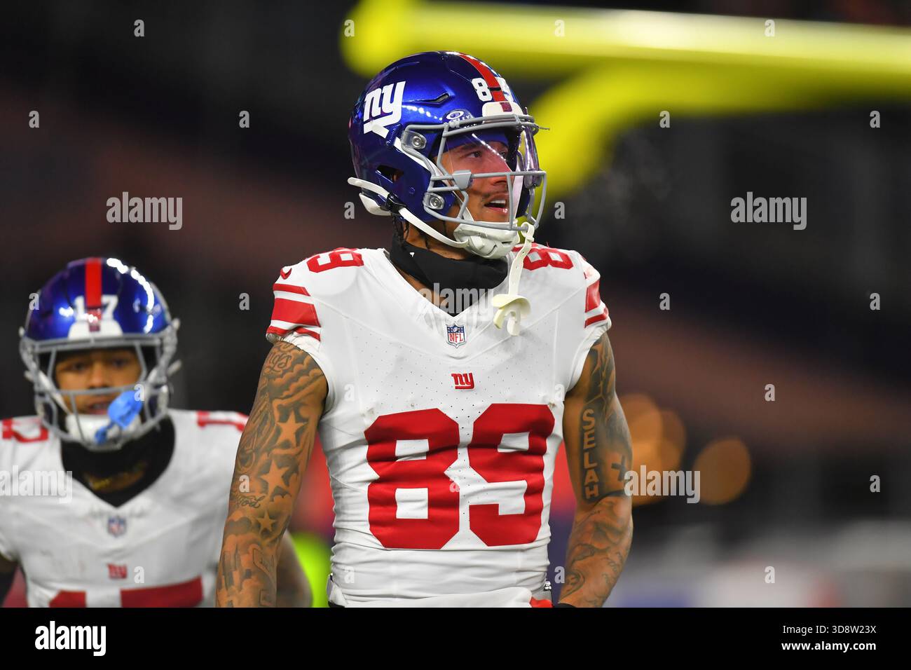 New York Giants wide receiver Isaiah Hodgins walks on the field in the ...