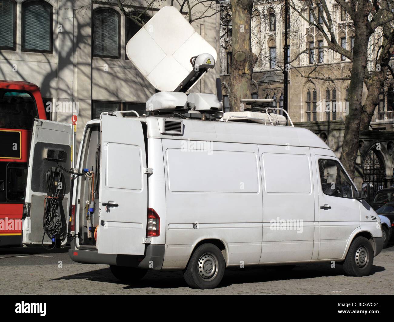 Outside broadcast mainstream white van media vehicle broadcasting for a ...