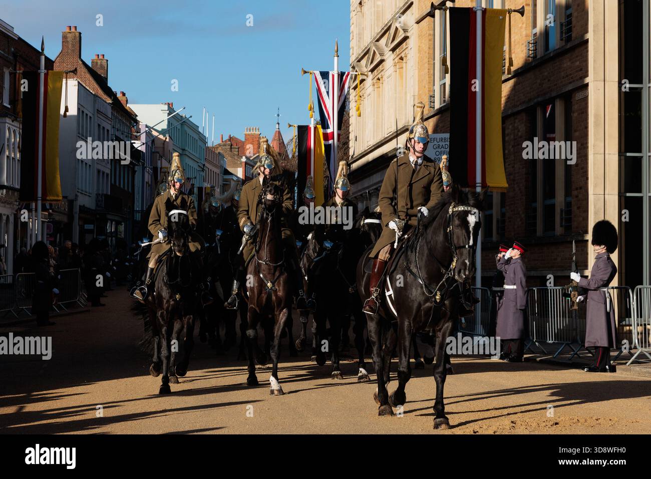 Windsor, UK. 2nd December, 2025. Mounted guardsmen pass along the High ...