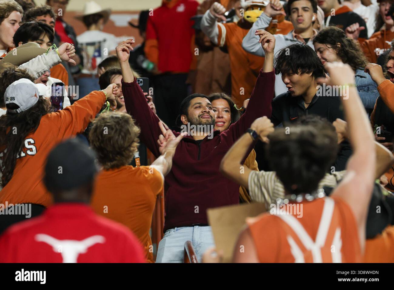 AUSTIN, TX - NOVEMBER 28: A Texas A&M fan walks through hostile Texas ...