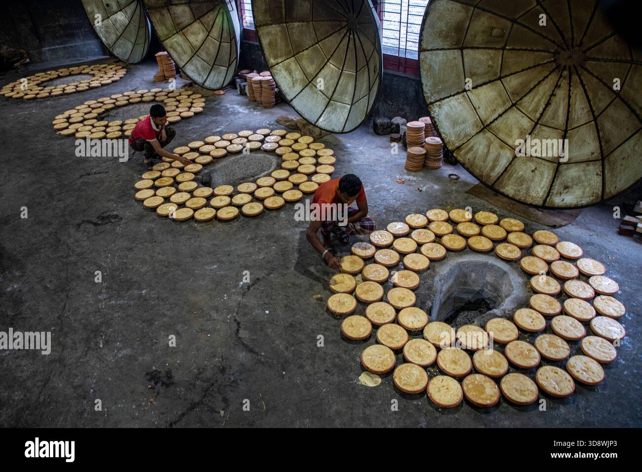 The art of yogurt making: workers producing the renowned bogra doi with ...
