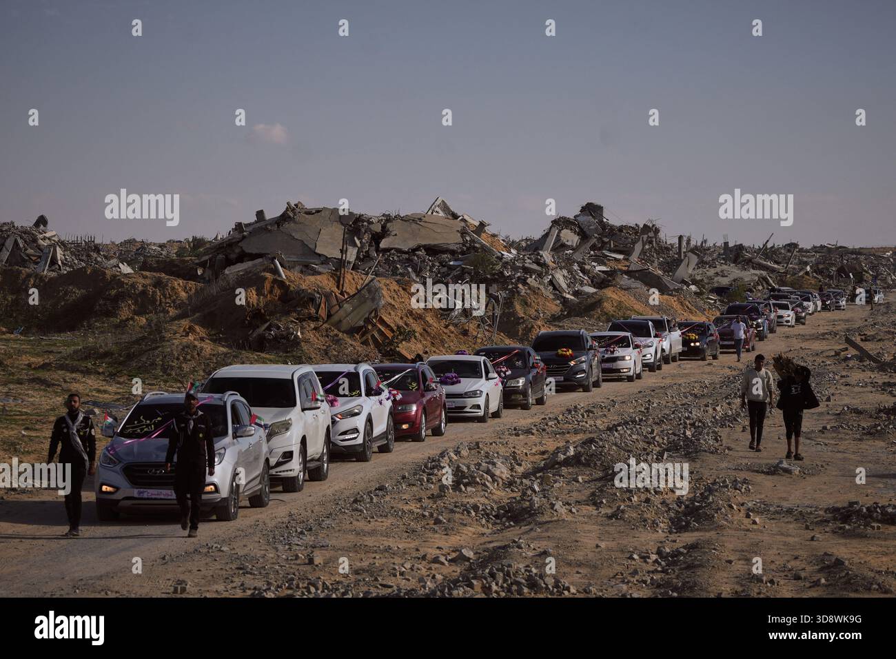 A convoy of Palestinian grooms travels to Hamad City in Khan Yunis, in ...