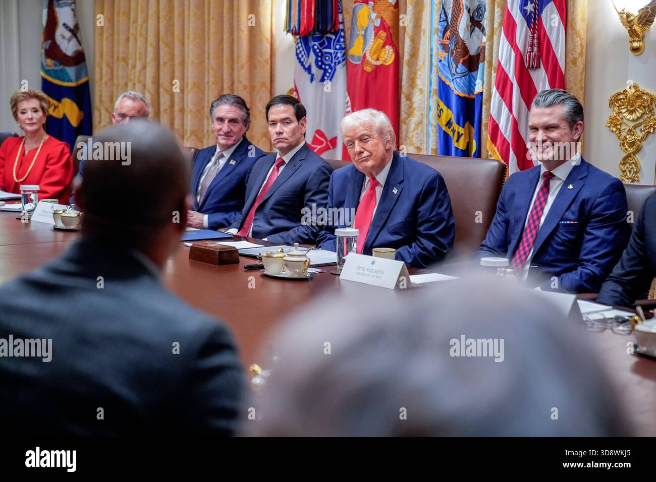 United States President Donald J Trump listens as he holds a meeting ...
