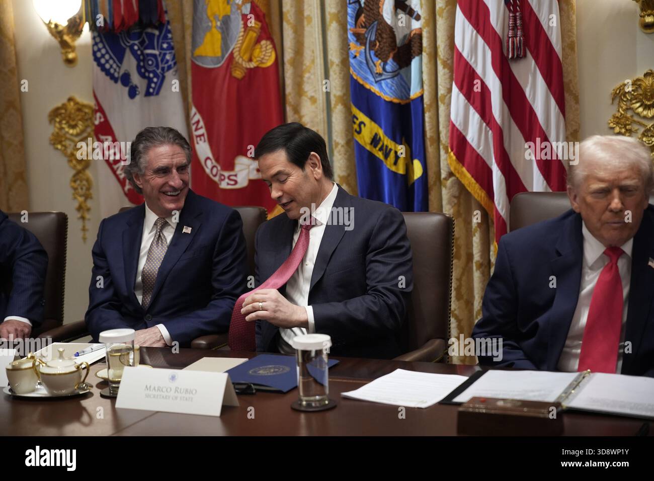 United States Secretary of State Marco Rubio, center, acknowledges his ...