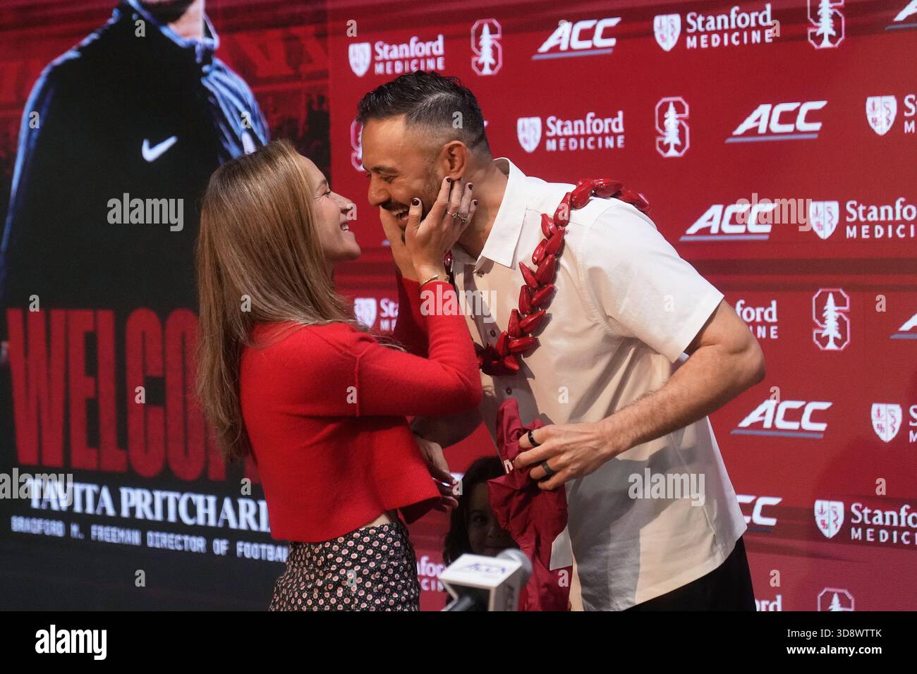 Tavita Pritchard, right, kisses his wife, Caroline, after he was ...