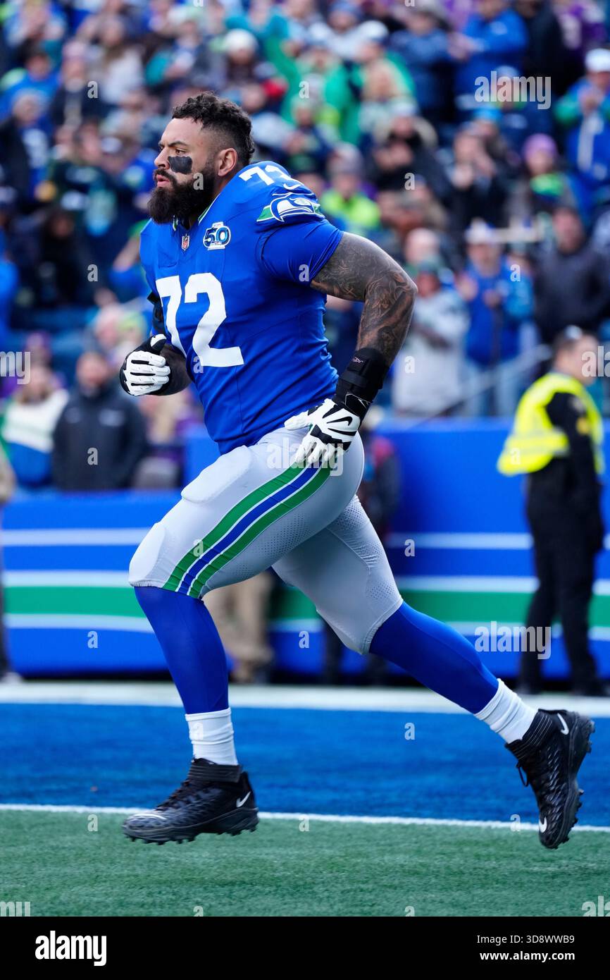 Seattle Seahawks offensive tackle Abraham Lucas (72) runs out on to the ...
