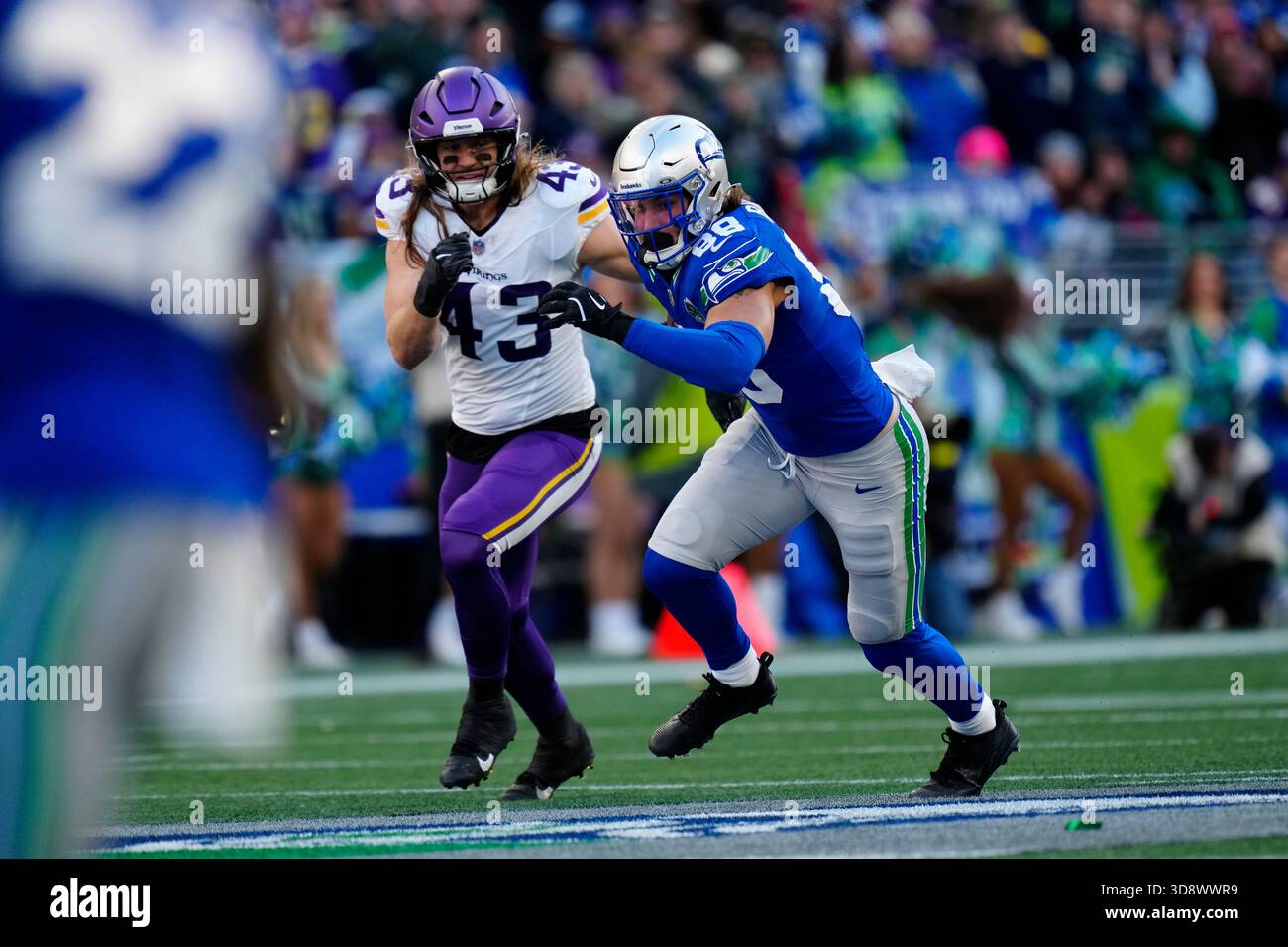 Seattle Seahawks tight end AJ Barner (88) and Minnesota Vikings ...