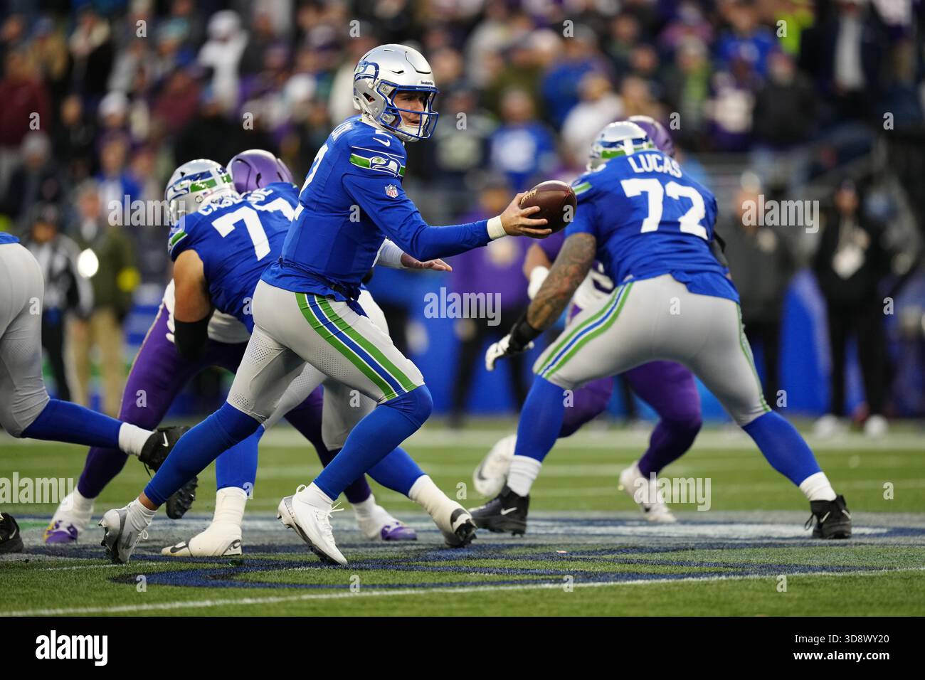 Seattle Seahawks quarterback Drew Lock (2) hands off the ball during an ...