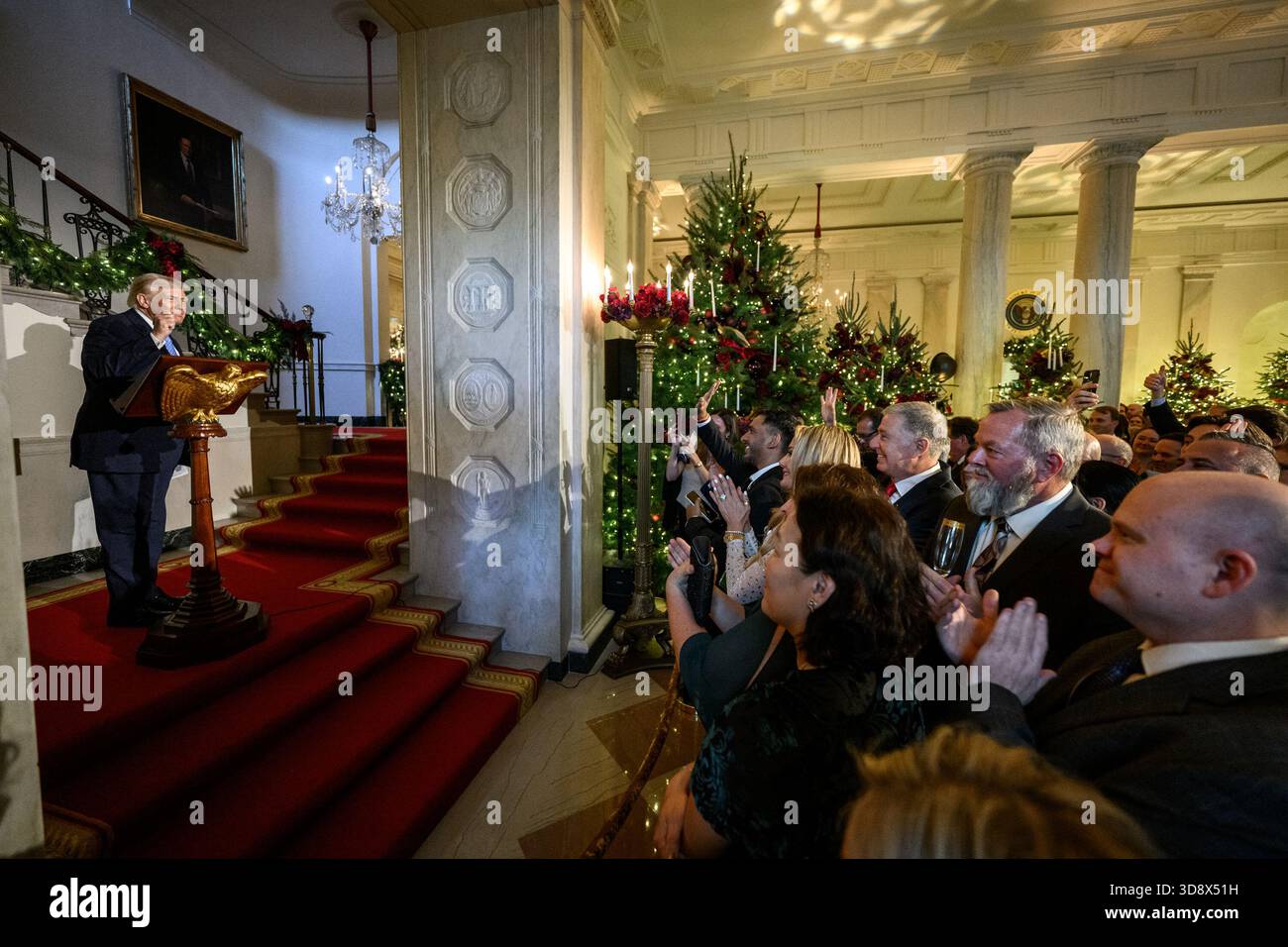 President Donald Trump delivers remarks to staff during a Christmas ...