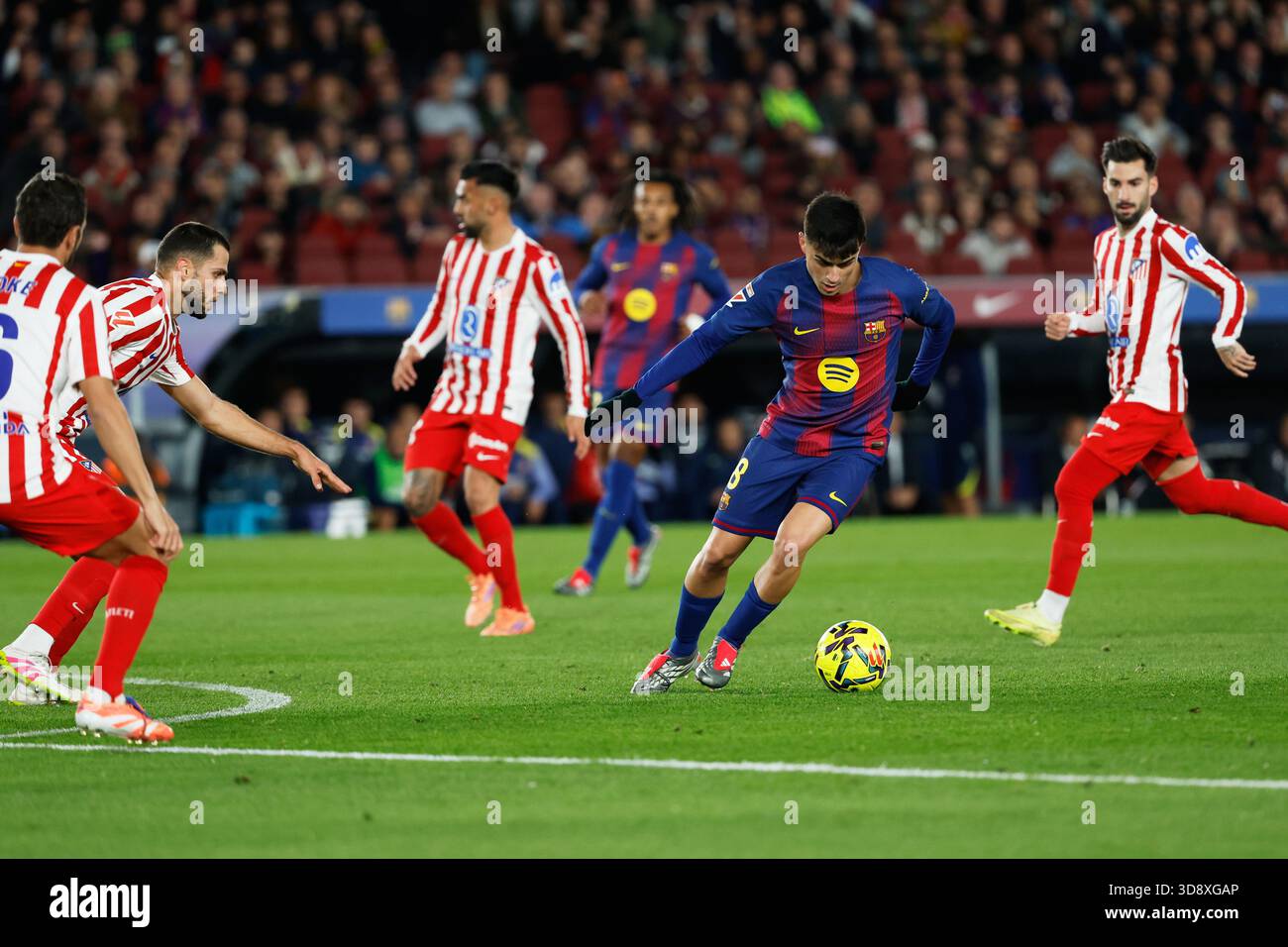 Barcelona's Pedri runs with the ball during a Spanish La Liga soccer ...