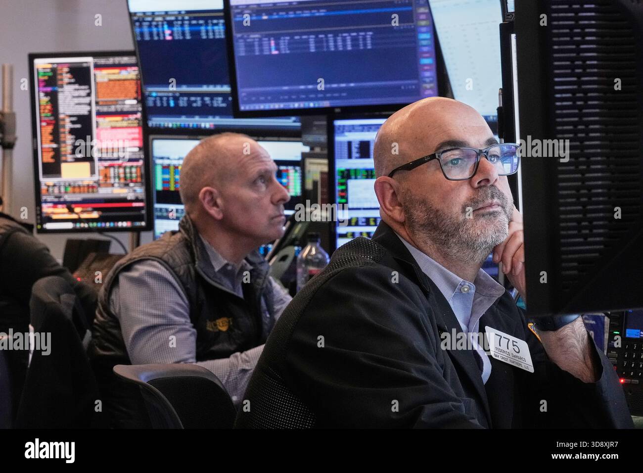 Traders Michael Urkonis, left, and Fred Demarco work on the floor of ...