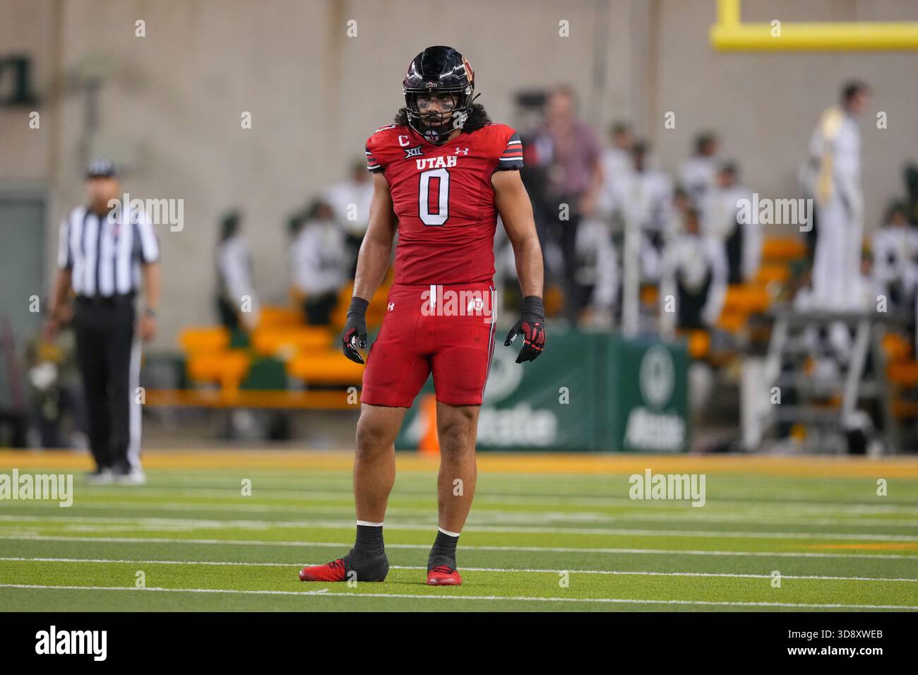 Utah defensive end Logan Fano looks on during the first half of an NCAA ...