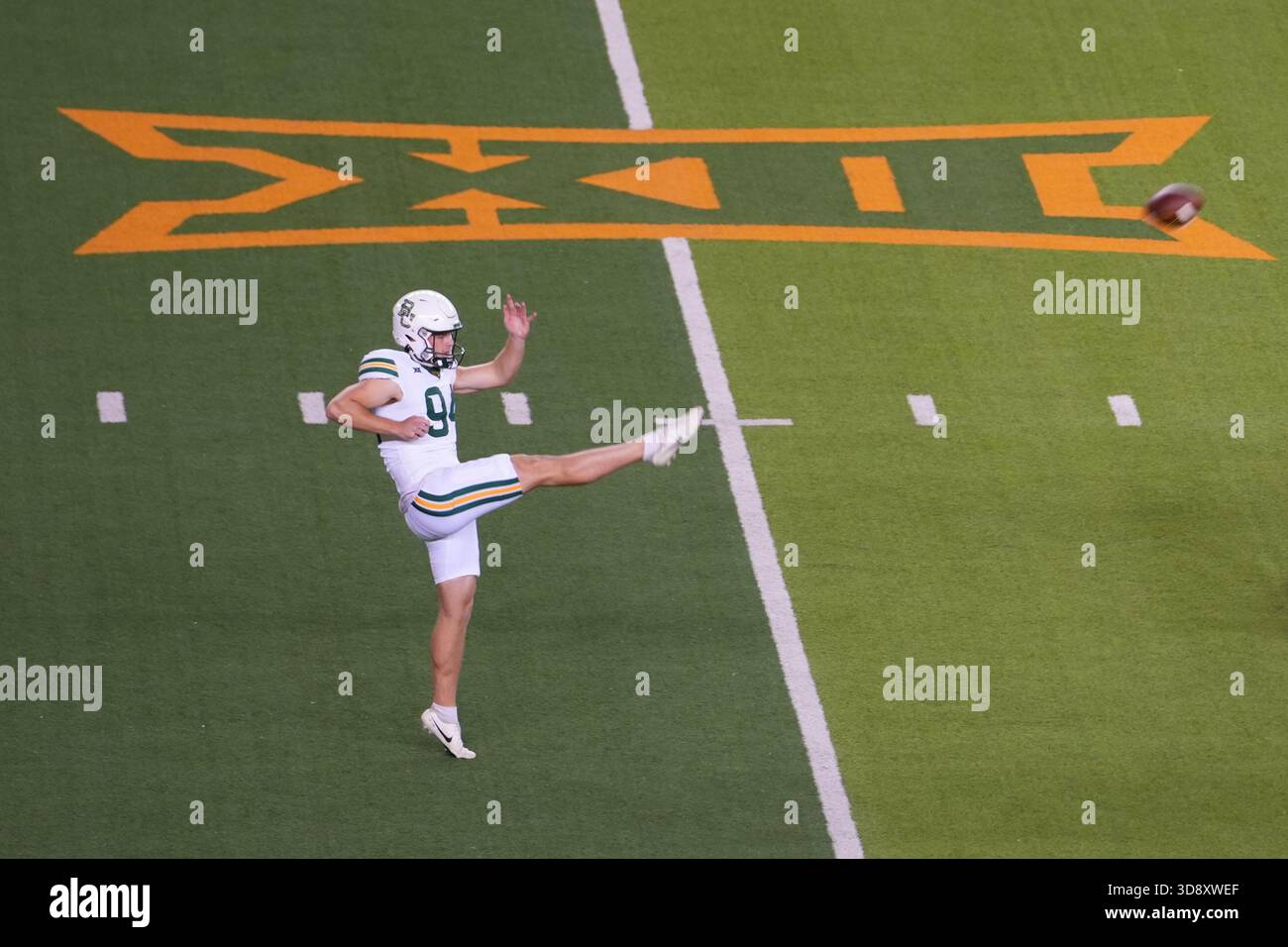 Baylor punter Palmer Williams boots the ball during the first half of ...