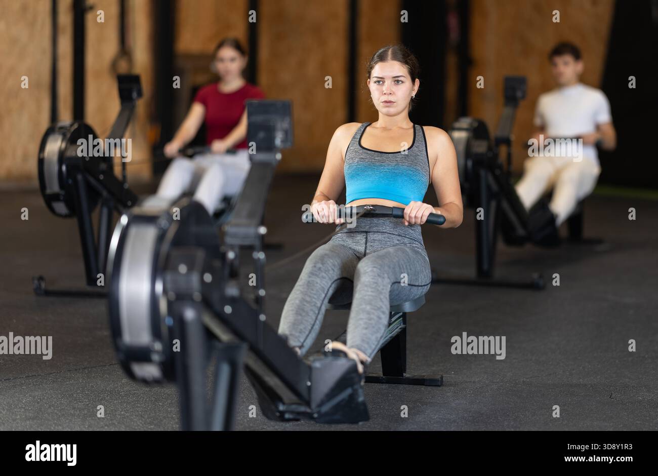 Rowing woman on ergometer hi-res stock photography and images - Alamy