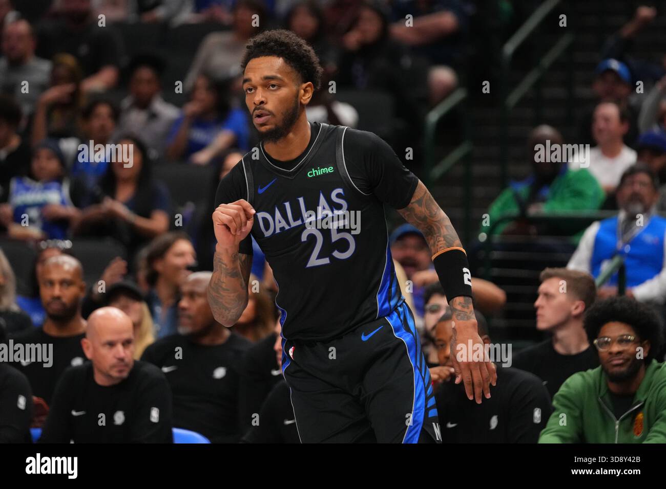 Dallas Mavericks forward P.J. Washington looks on after taking a shot ...