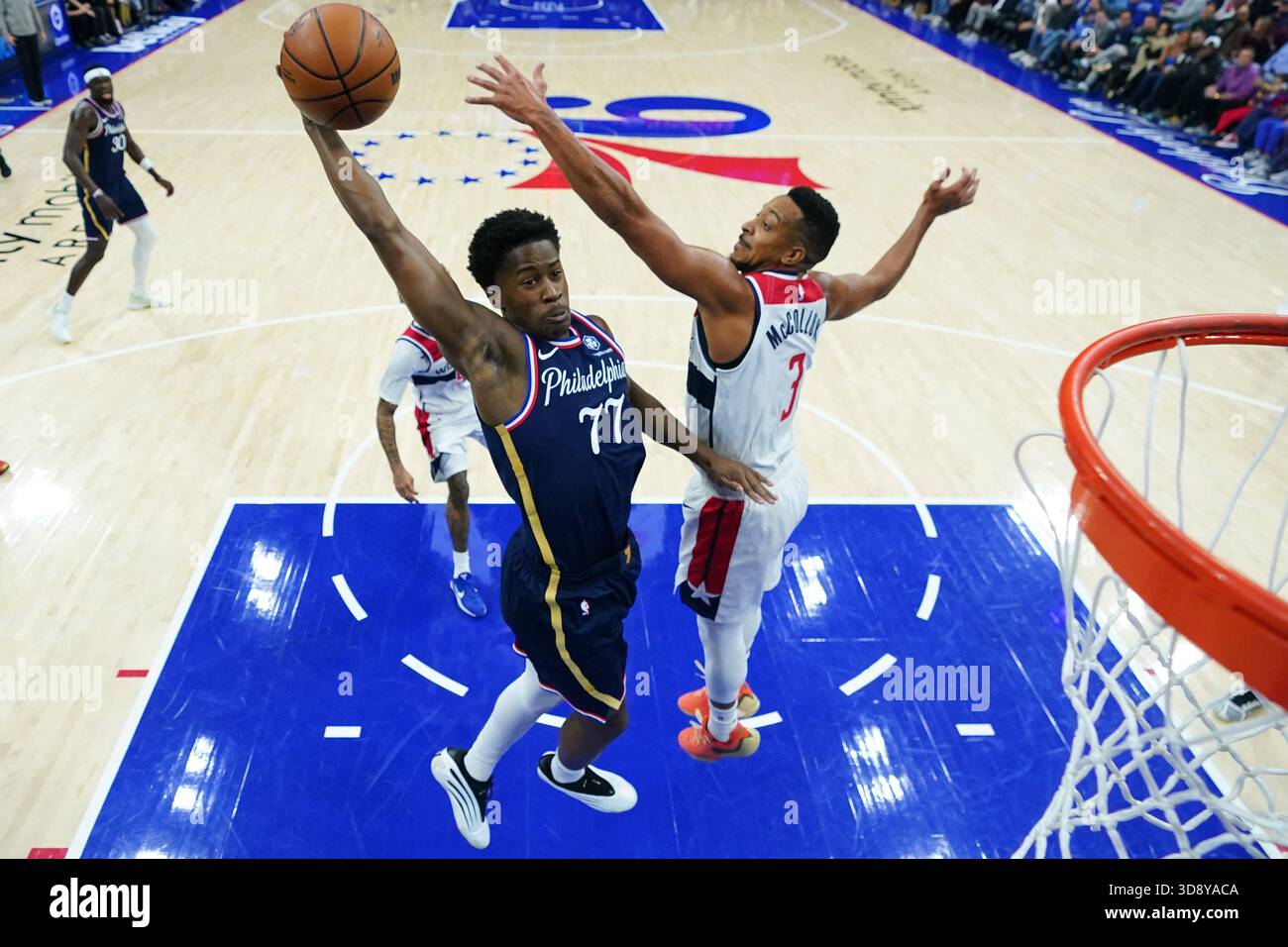 Philadelphia 76ers' VJ Edgecombe, left, goes up for a dunk past ...