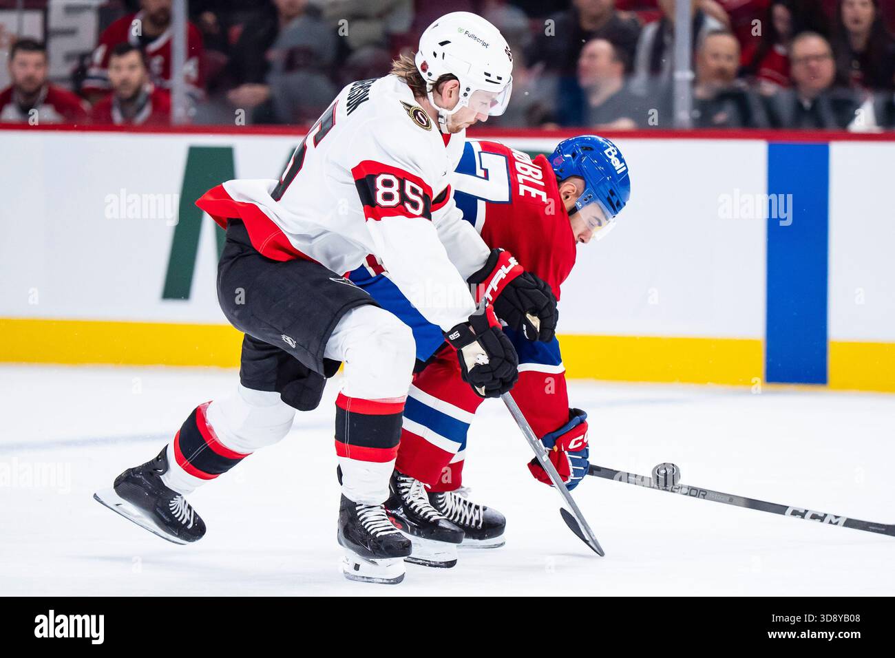 Ottawa Senators' Jake Sanderson (85) and Montreal Canadiens' Jayden ...