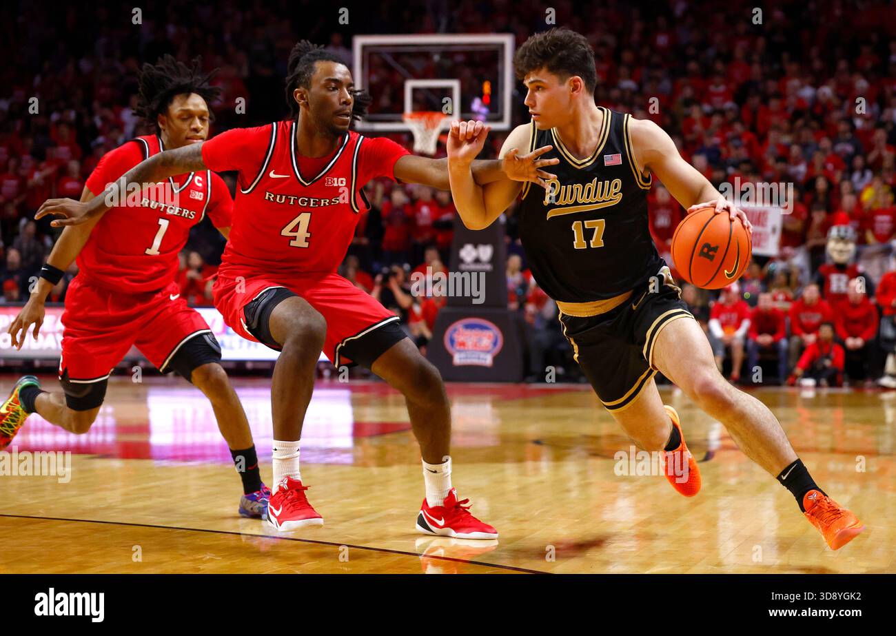 Purdue guard Omer Mayer (17) drives to the basket against Rutgers ...