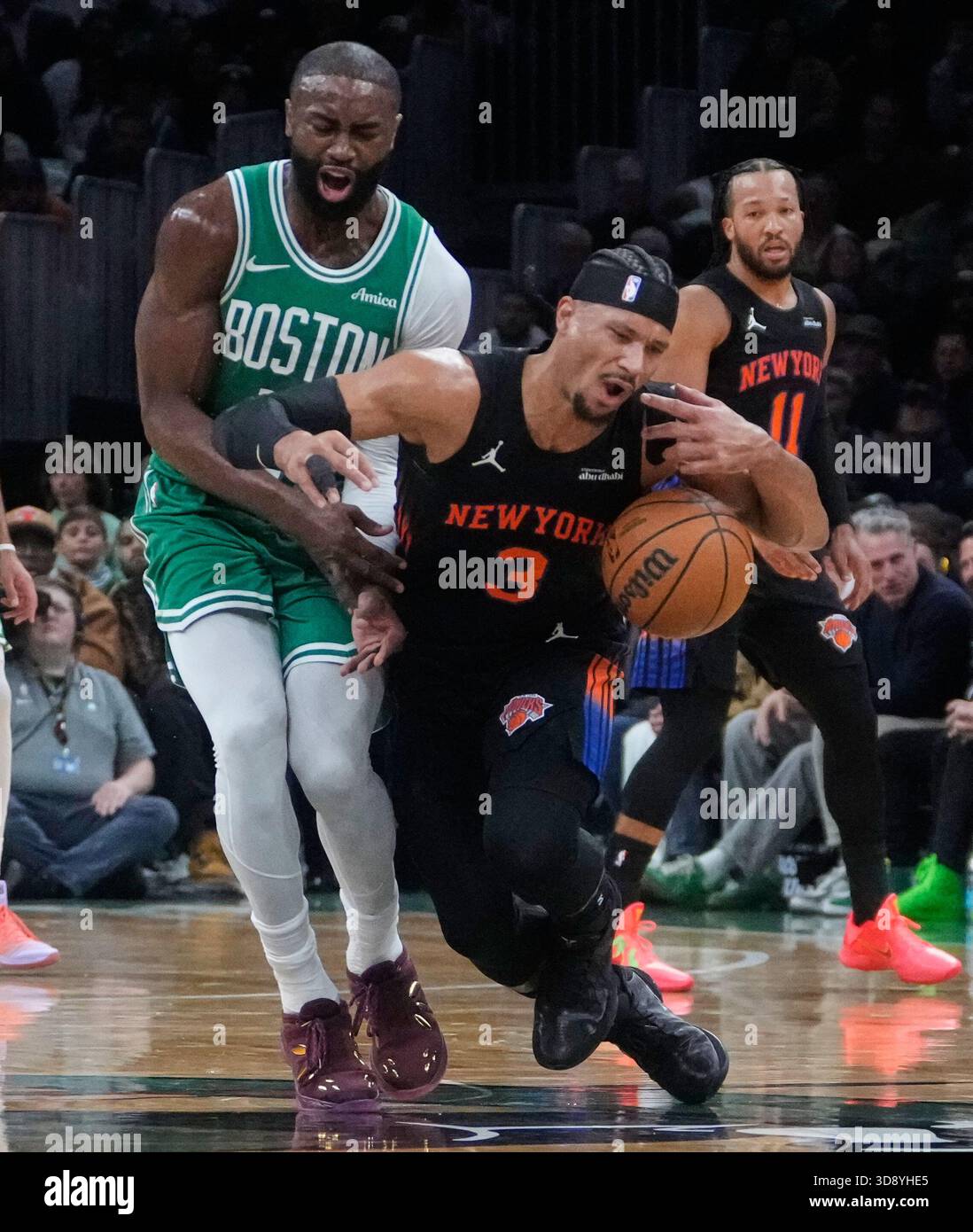 Boston Celtics guard Jaylen Brown, left, collides with New York Knicks ...
