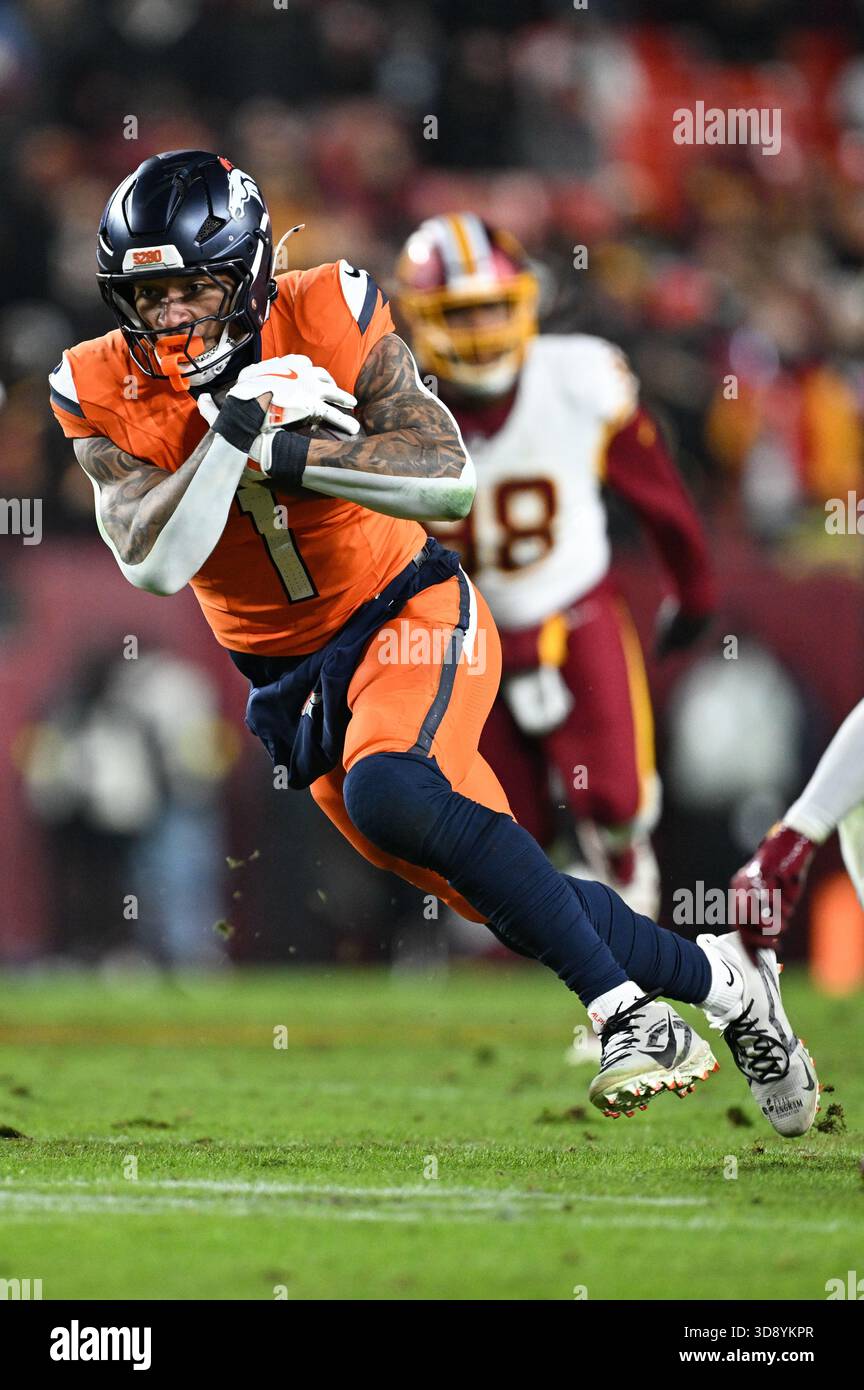 Denver Broncos tight end Evan Engram (1) runs with the ball after ...