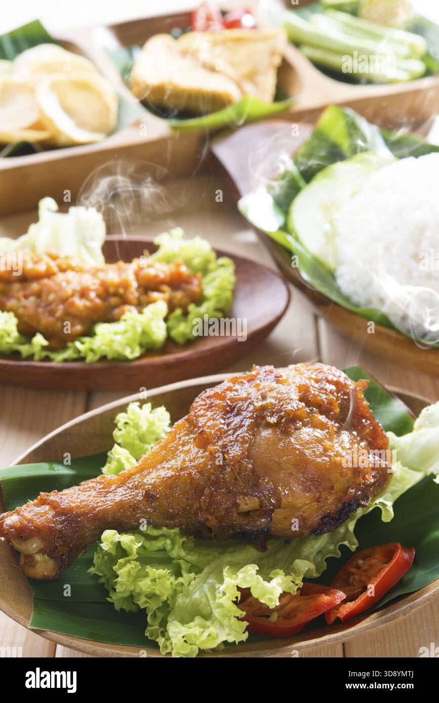 Delicious nasi ayam penyet with sambal belacan. Fried chicken rice with ...