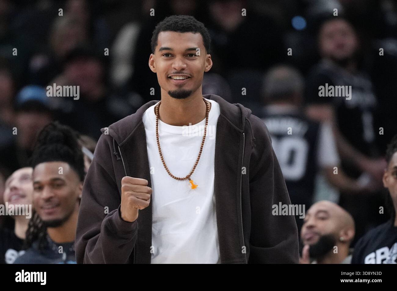 San Antonio Spurs forward Victor Wembanyama cheers on teammates from ...