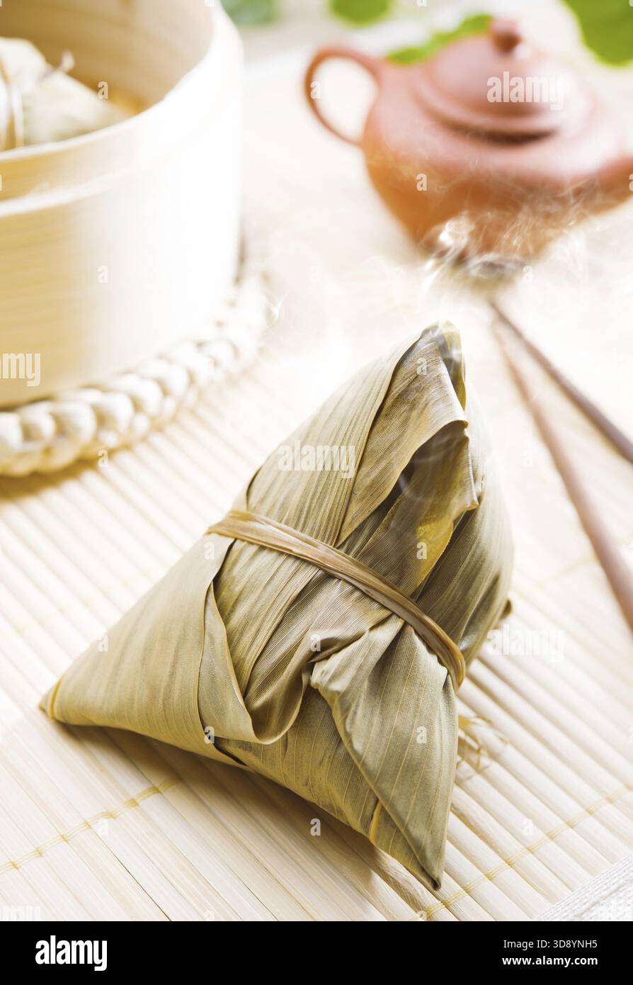 Zongzi or rice dumpling. Traditional steamed sticky glutinous rice ...