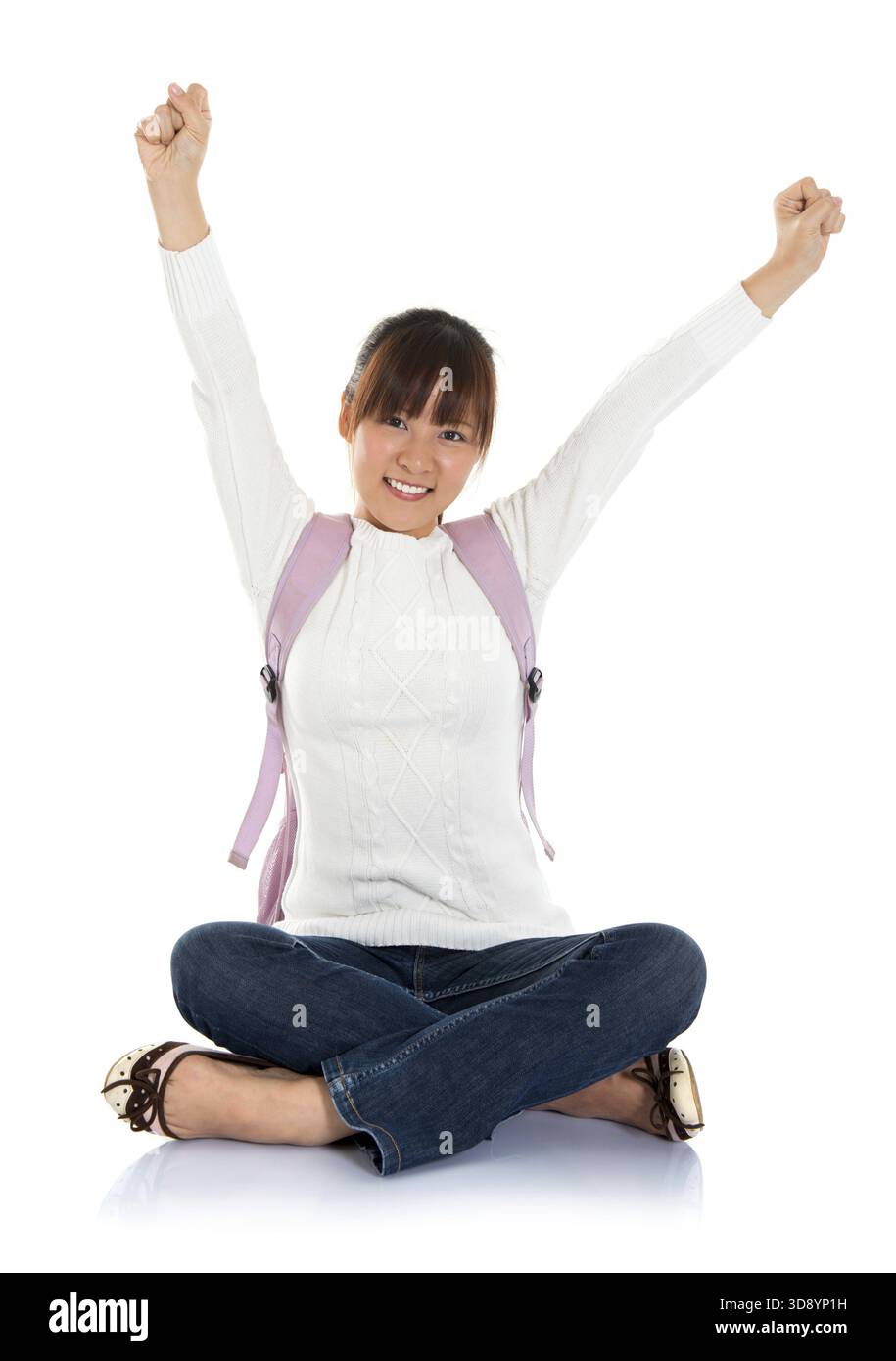 Full body excited Asian female young adult student sitting on floor ...