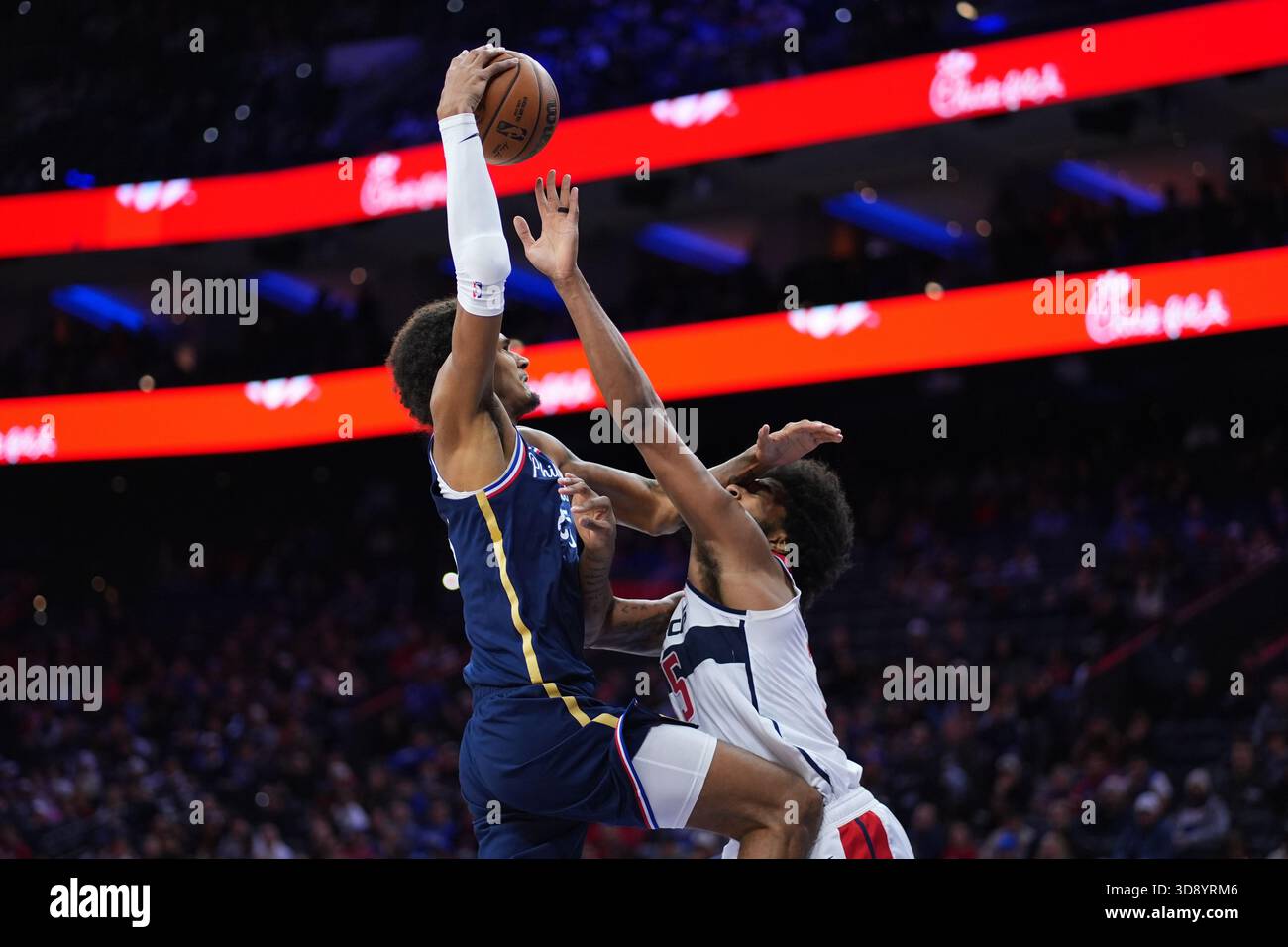 Philadelphia 76ers' Dominick Barlow, left, goes up for a shot against ...