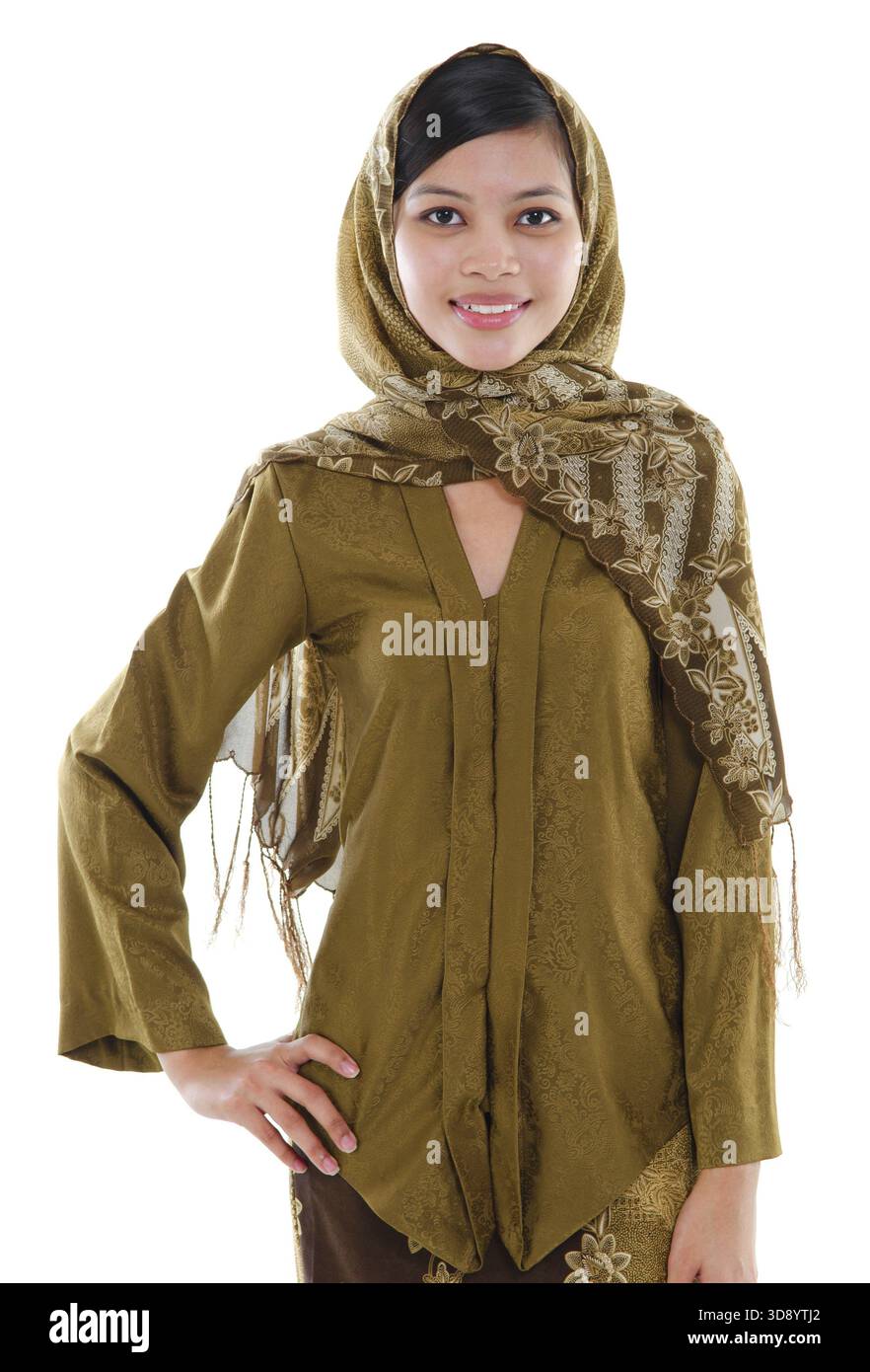 Portrait of a young attractive Southeast Asian muslim woman standing ...