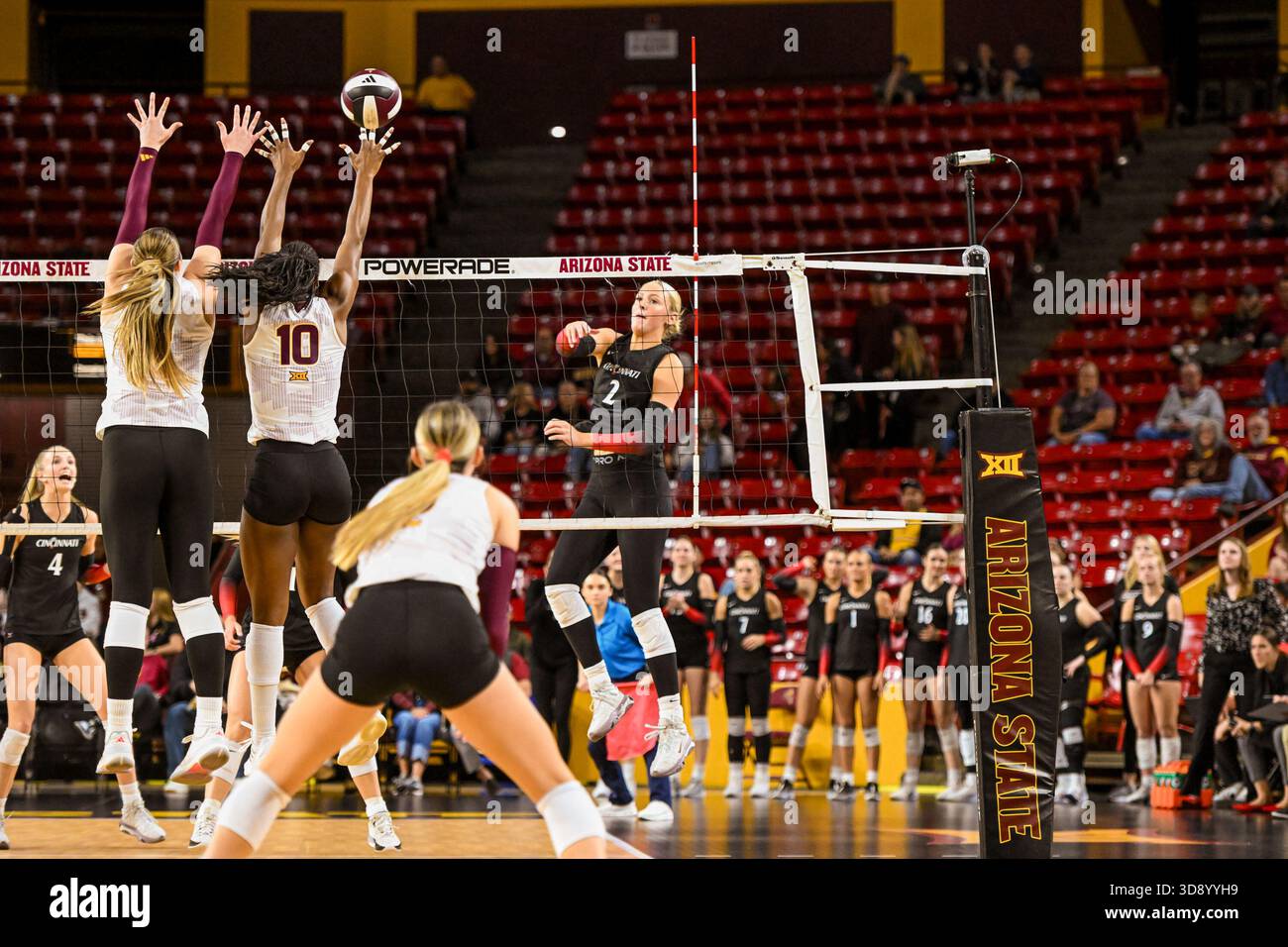 Cincinnati Bearcats outside hitter Sydney Nolan (2) hits the ball in ...