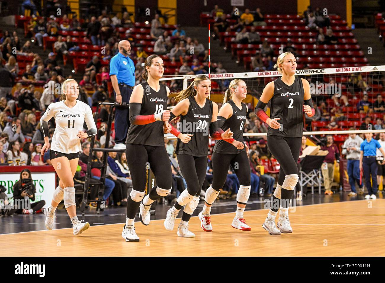Cincinnati Bearcats switch side after a victory in the first set of the ...