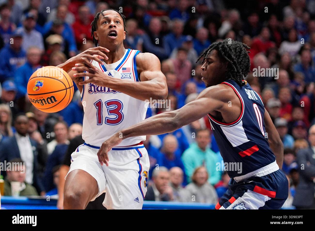 UConn guard Malachi Smith (0) knocks the ball away from Kansas guard ...
