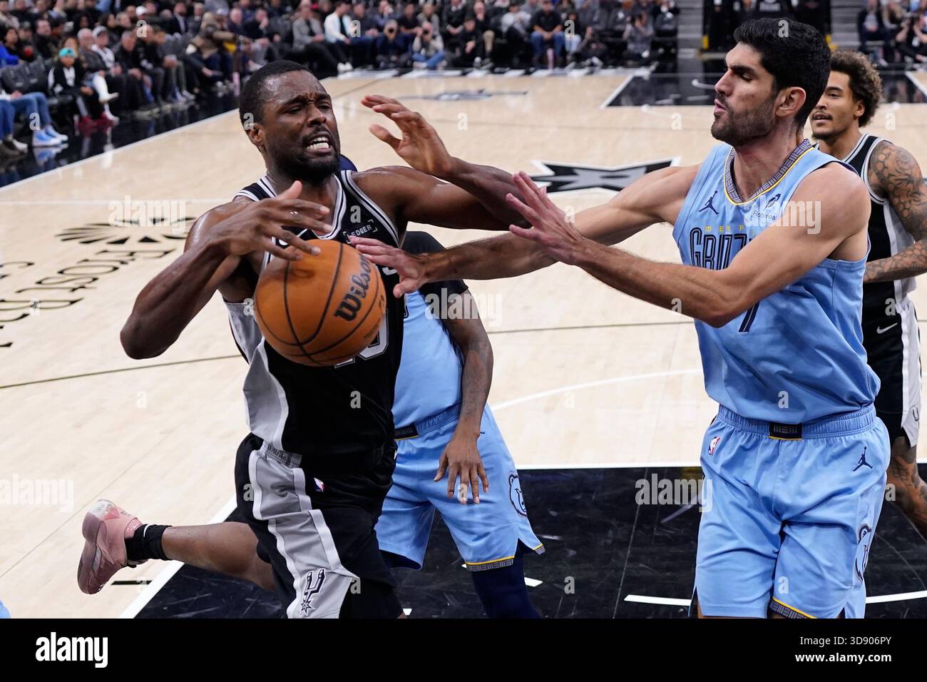 San Antonio Spurs forward Harrison Barnes, left, drives to the basket ...