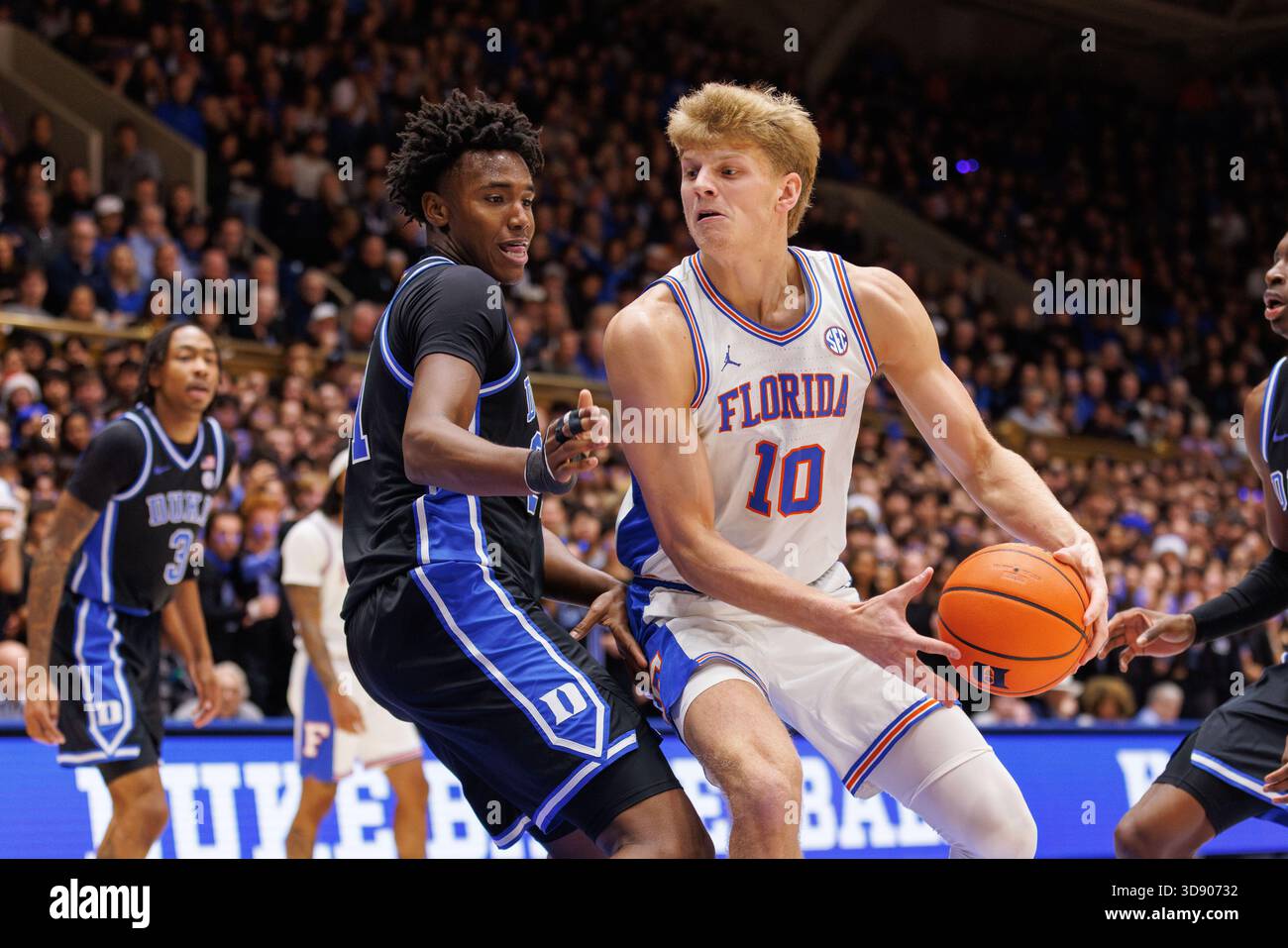 Florida's Thomas Haugh (10) drives against Duke's Patrick Ngongba II ...