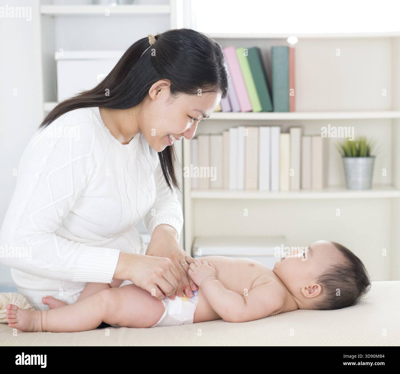 Changing child asia hi-res stock photography and images - Alamy