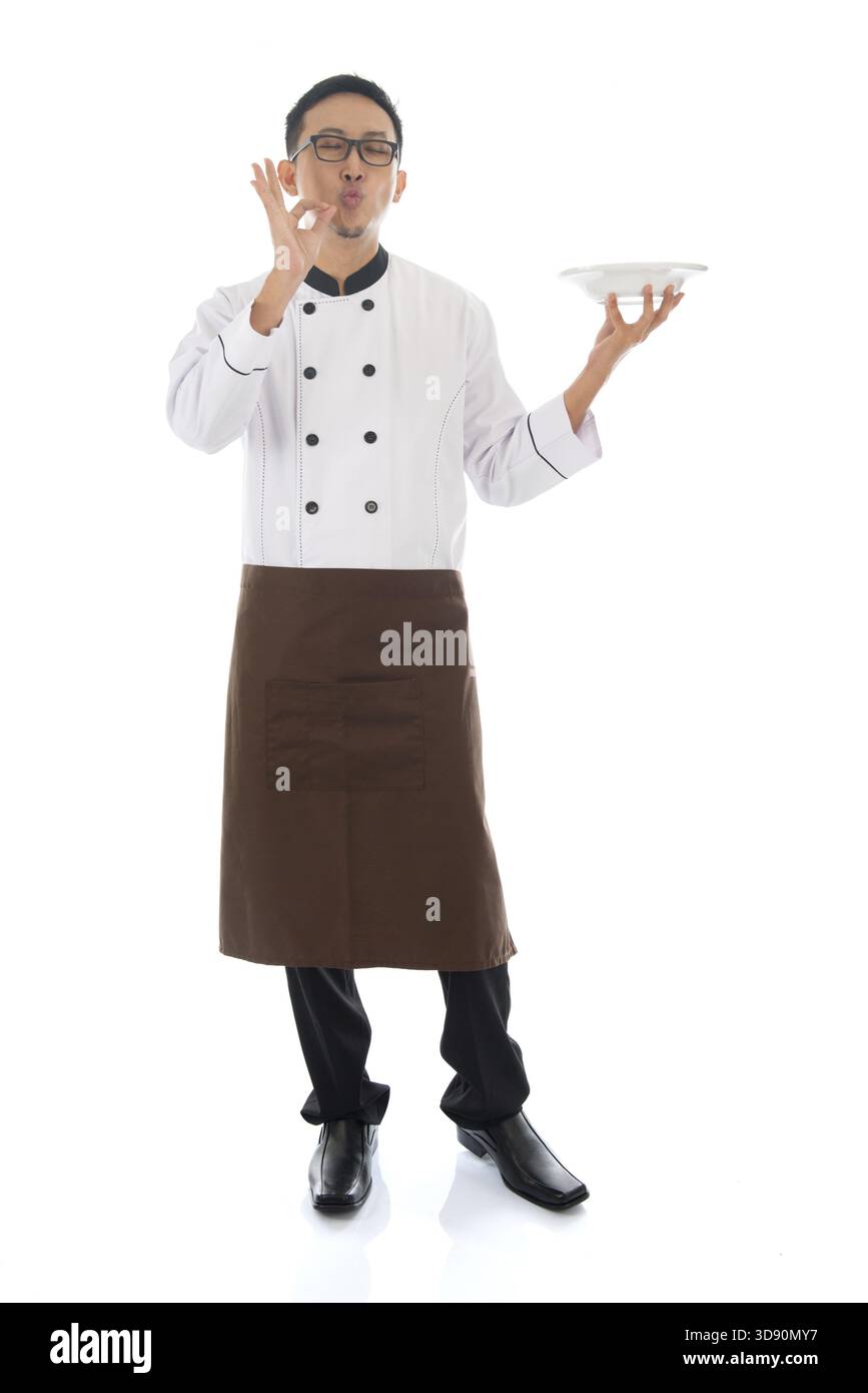 Full body Asian chef holding an empty plate, showing tasty and ...