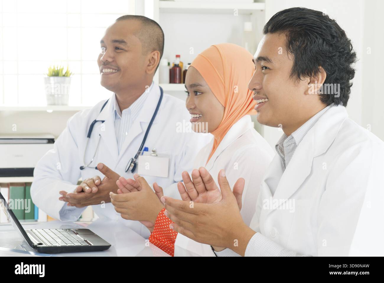 Joyful medical team clapping hi-res stock photography and images - Alamy