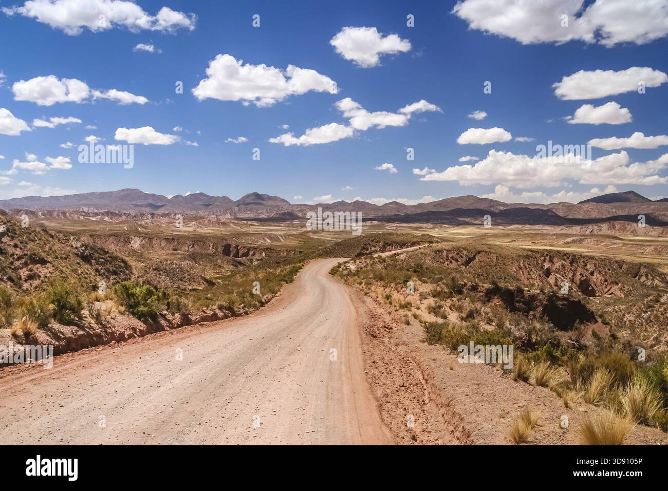 Empty and dusty gravel desert road through remote part of central ...