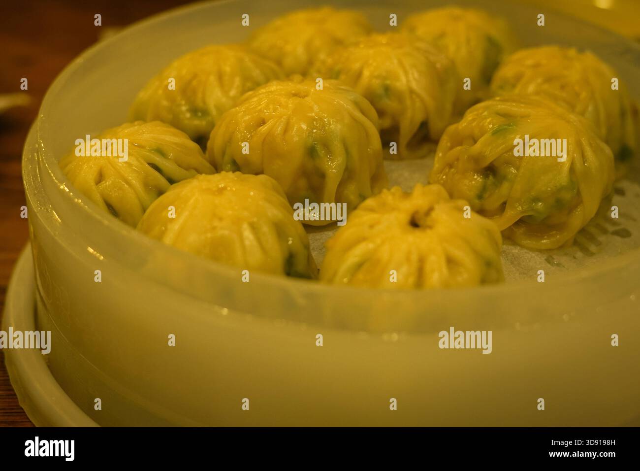 Warm Korean Pork Dumplings (Mandu) with Yellow Skin Steamed in a Bamboo ...