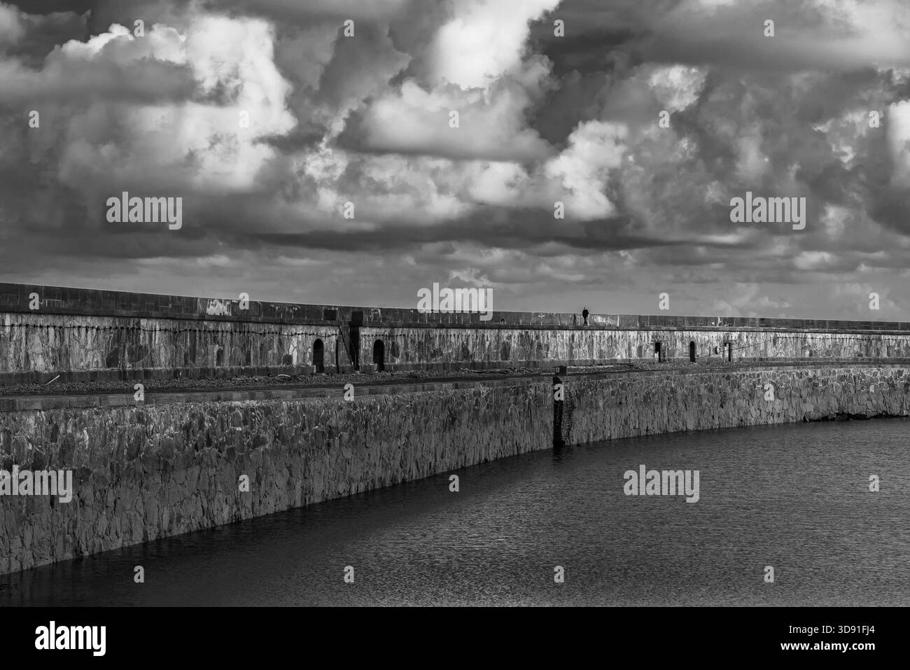 Lone man in black hi-res stock photography and images - Alamy