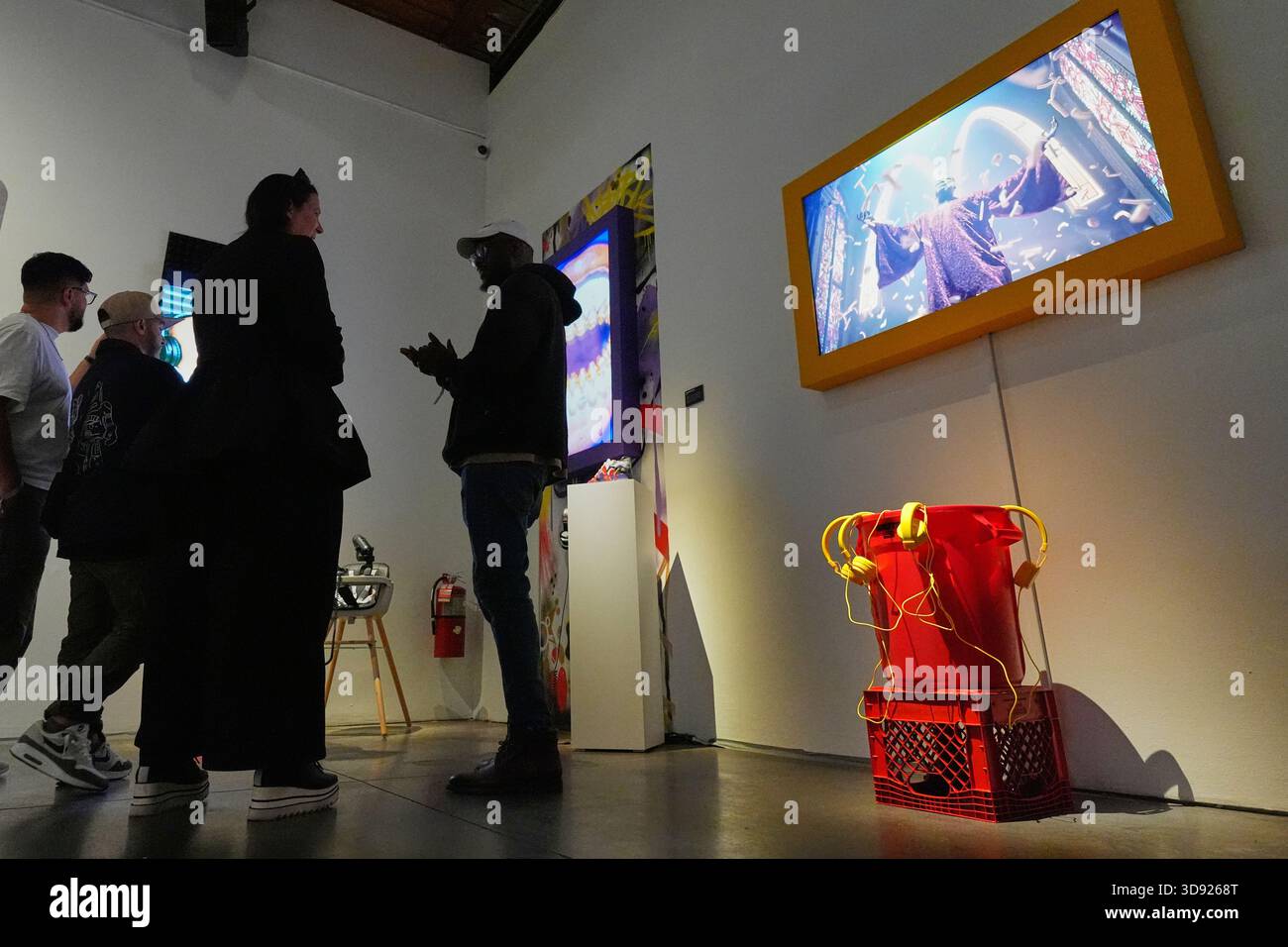 Willonius Hatcher, also known as King Willonius, talks to people during ...