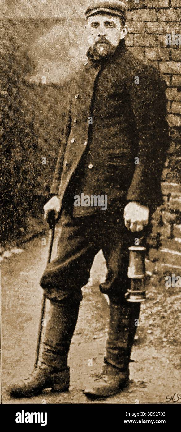 1901 A formal family portrait of a British coal miner and his lamp (not ...
