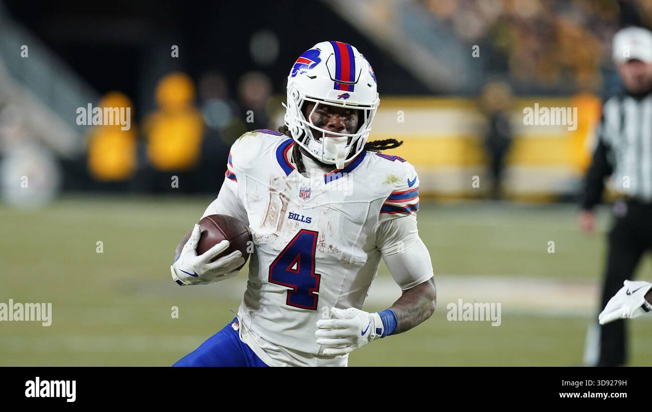 Buffalo Bills running back James Cook III (4) carries during the first ...