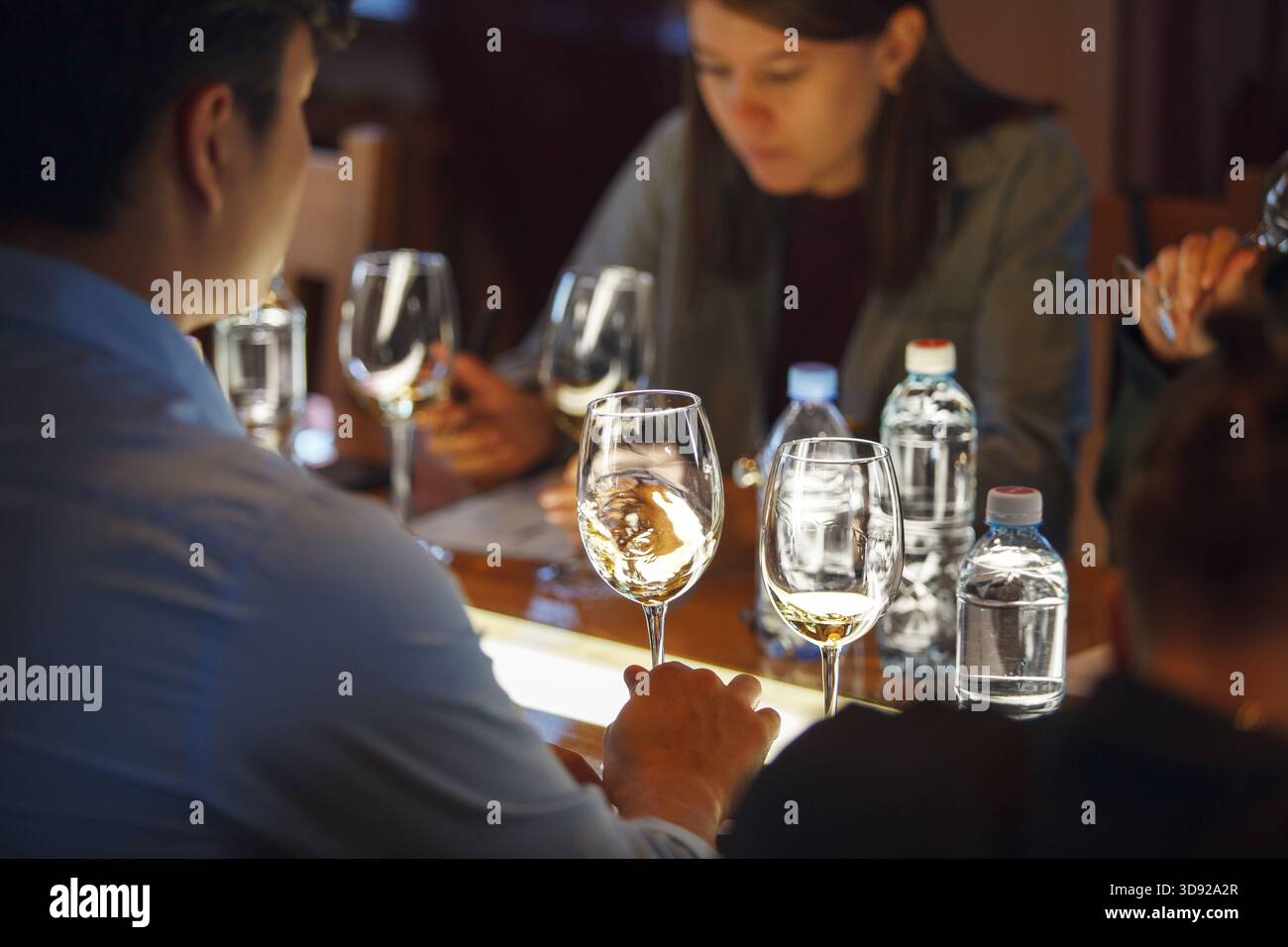 Group people sitting table in hi-res stock photography and images - Alamy