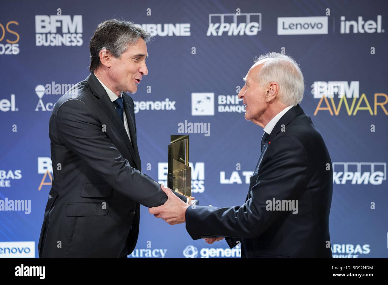 CEO of Thales Group, Patrice Caine shake hands with Chairman and CEO of ...