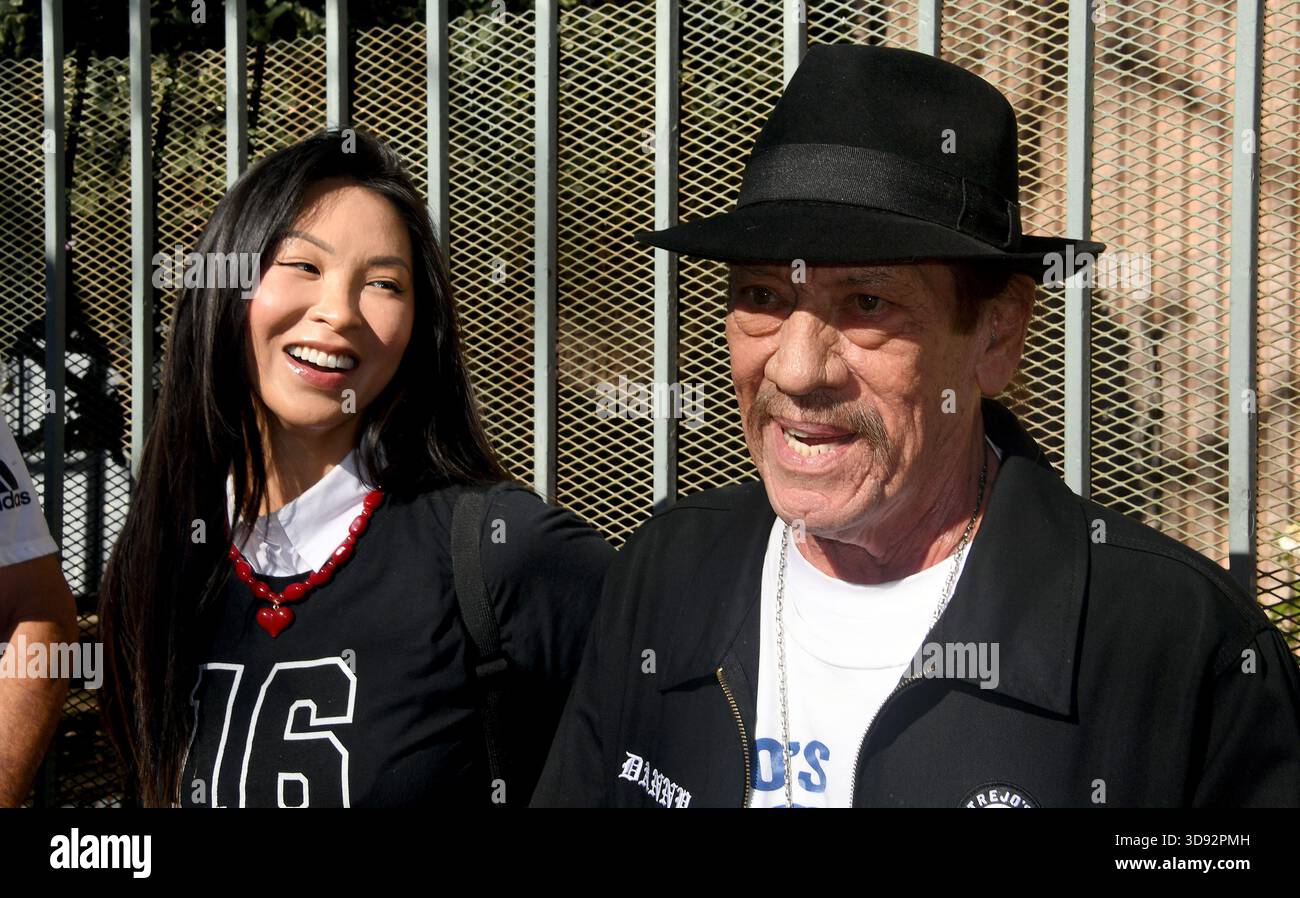 Actor Danny Trejo poses with model/actress Jessica Lee at the LA Mission on Skid Row in Downtown ...