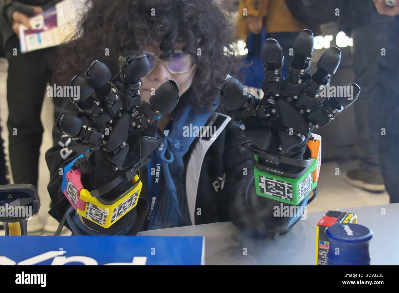 Visitor demonstrates Chinese PaXini's tactile sensing systems during ...
