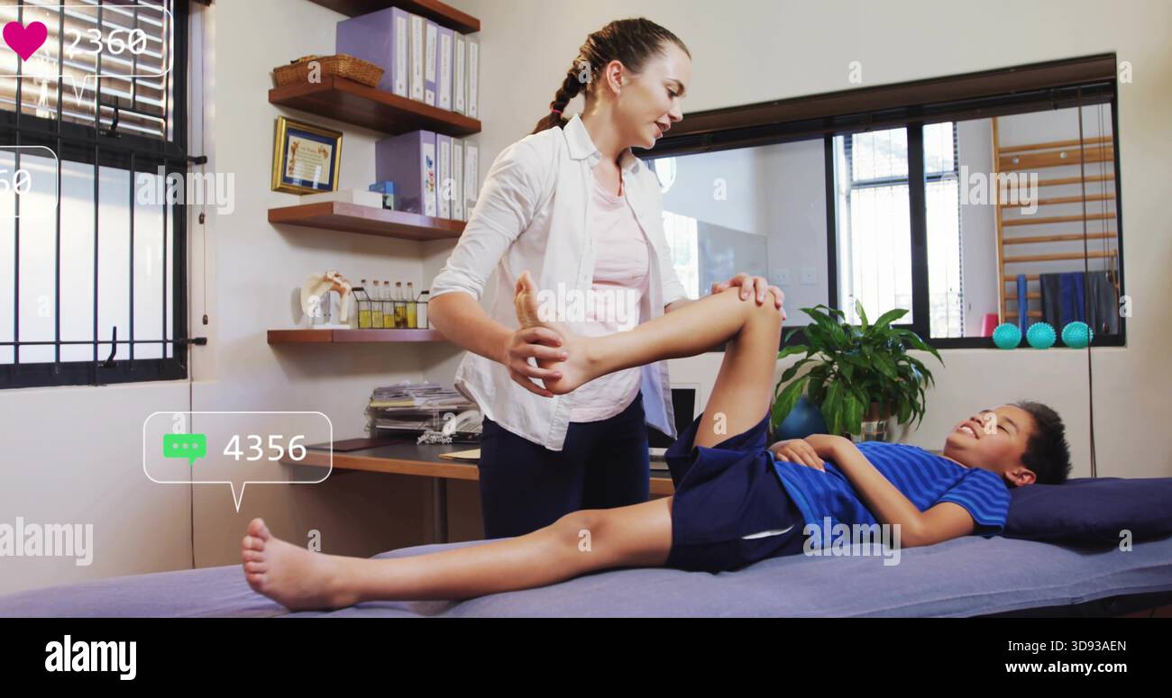 Holding female clinician in white shirt lifting boy in blue tee on ...